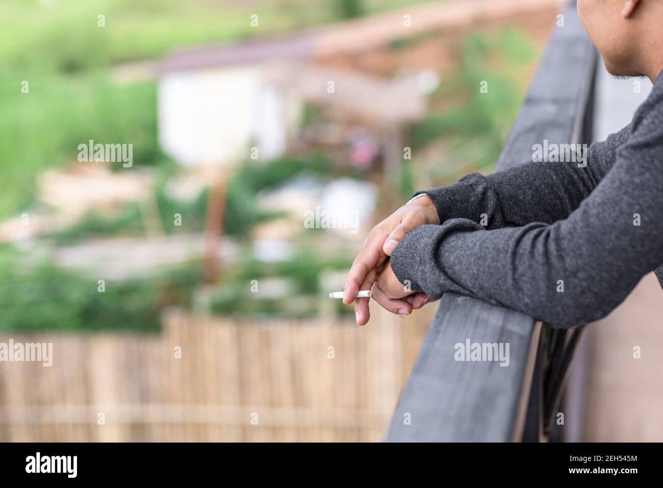 hands man pinch the cigarette on balcony at the hotel Stock Photo - Alamy