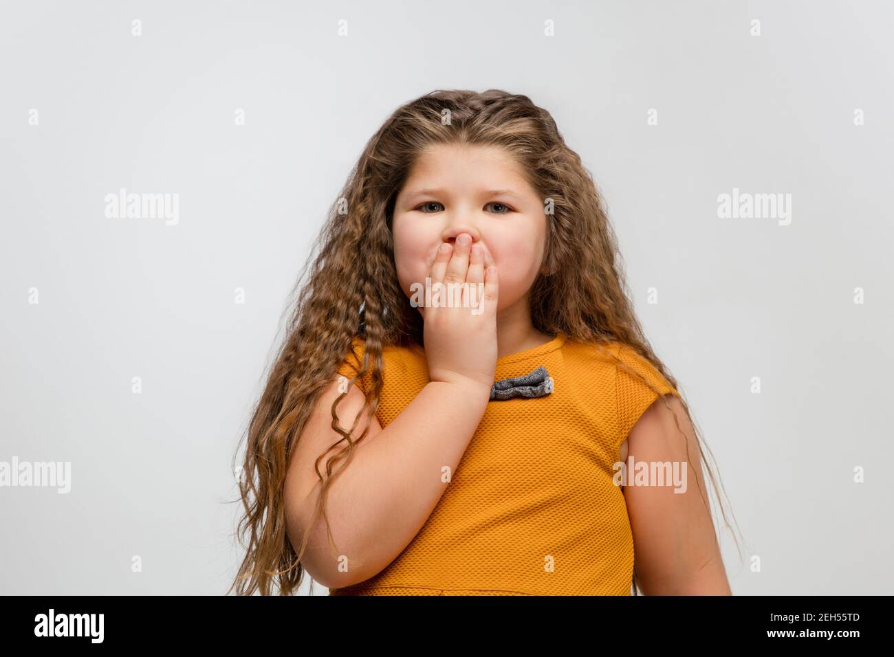 Shy, astonished. Happy, smiley little caucasian girl isolated on white ...