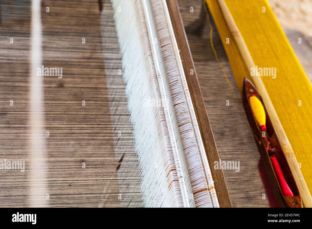 Weaving shuttle on weave silk cotton on the manual wood loom Stock ...