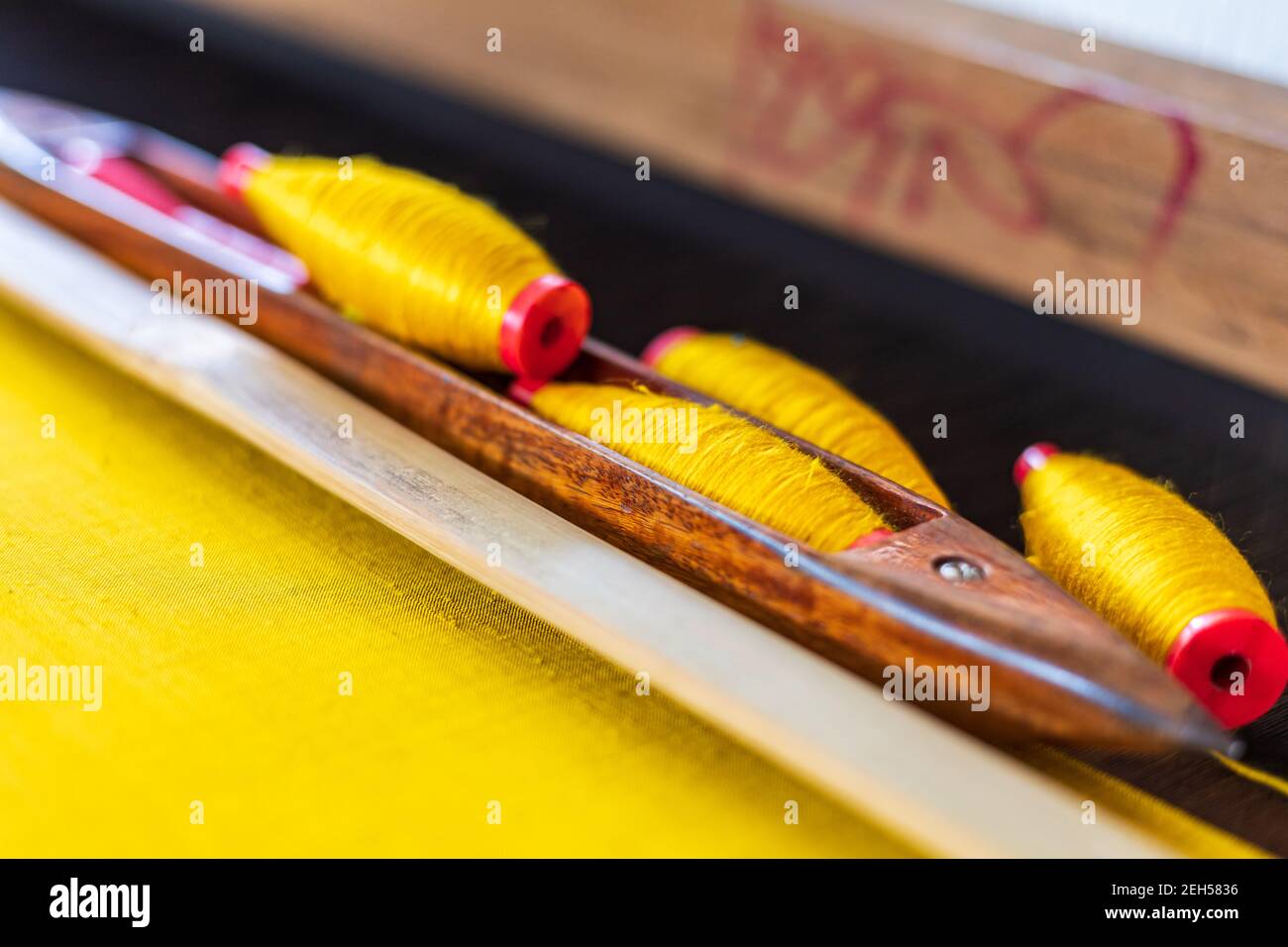 Weaving shuttle on weave silk cotton on the manual wood loom Stock ...