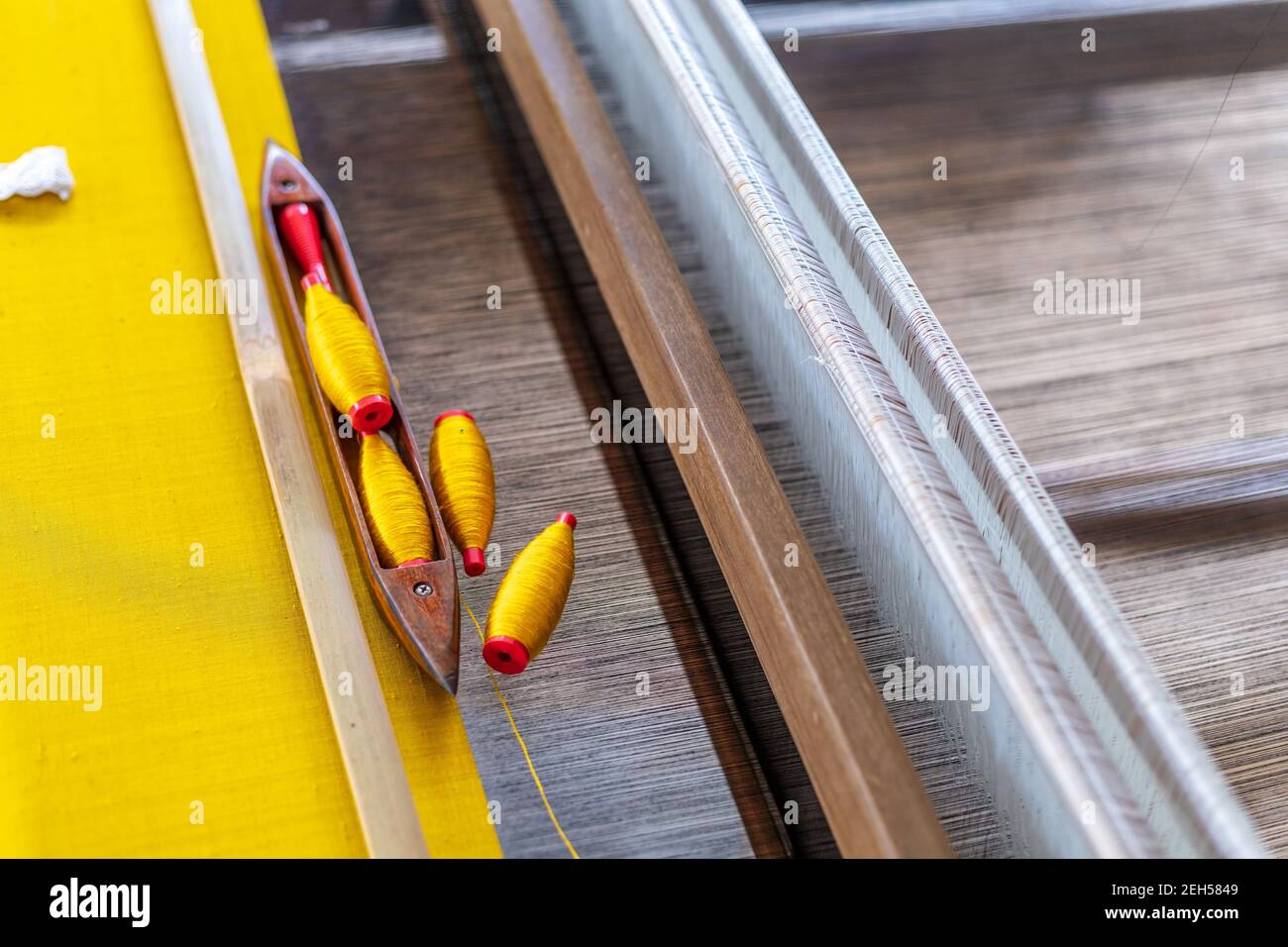 Weaving shuttle on weave silk cotton on the manual wood loom Stock ...