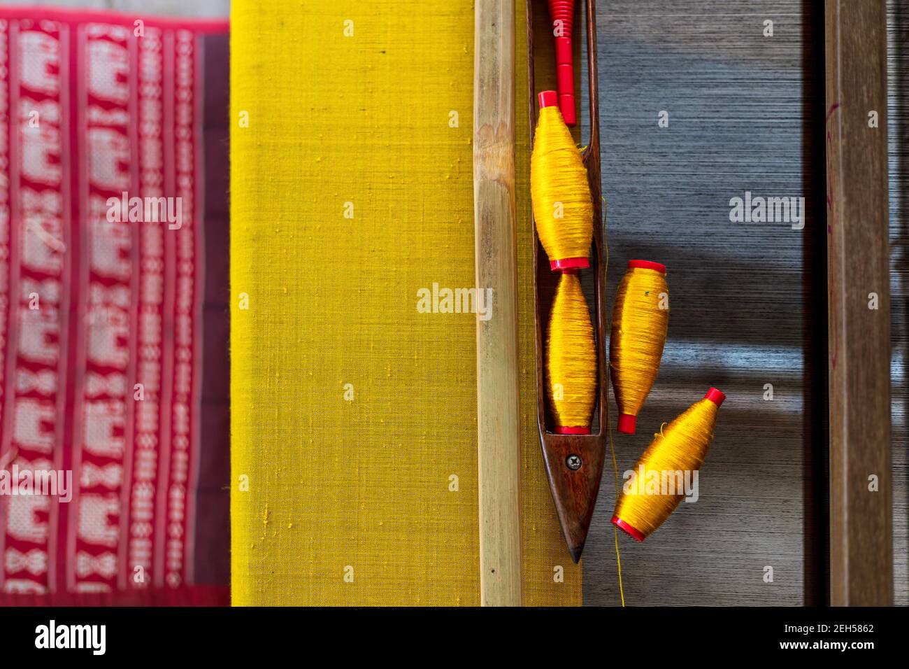 Weaving shuttle on weave silk cotton on the manual wood loom Stock ...