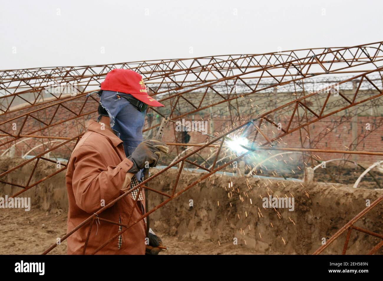 a worker Welding vegetable greenhouses, china Stock Photo - Alamy