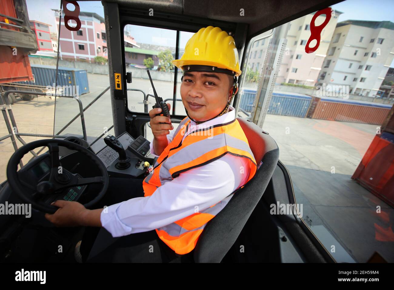 Foreman control loading Containers box from Cargo freight ship for ...