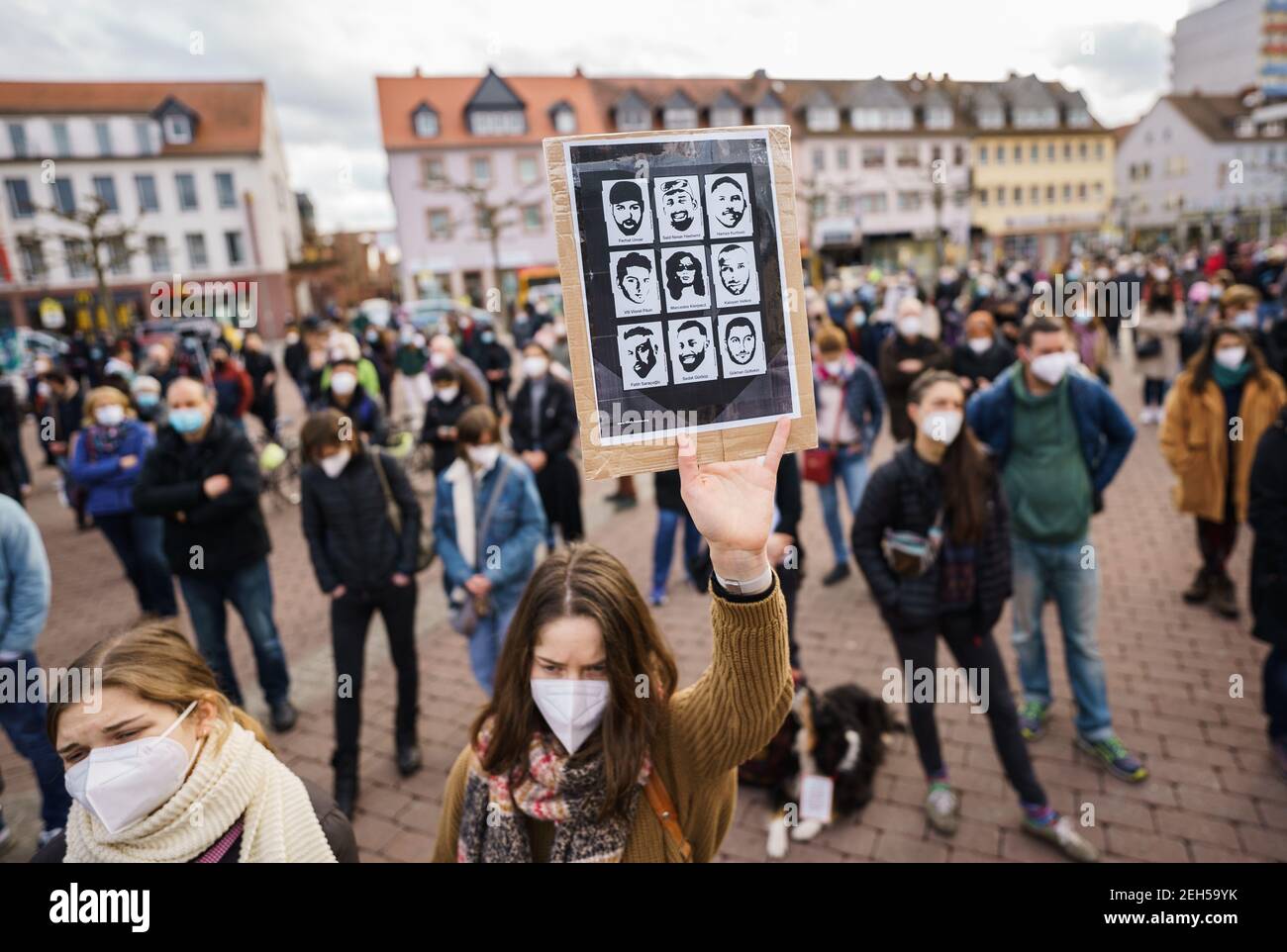 Hanau, Germany. 19th Feb, 2021. A poster with the portraits of the ...