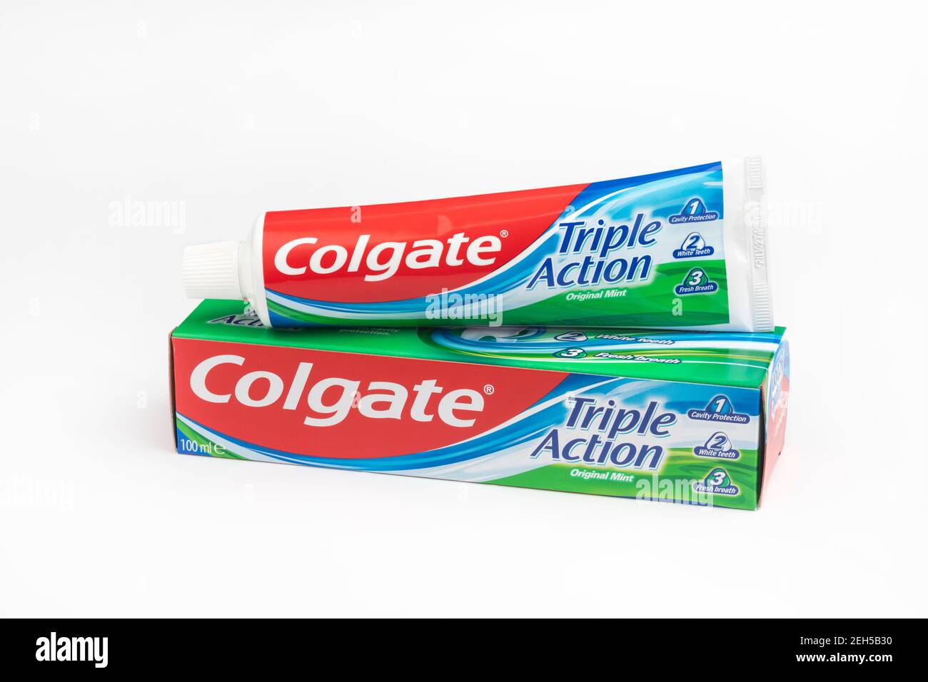 A packet and tube of Colgate triple action original mint toothpaste ...