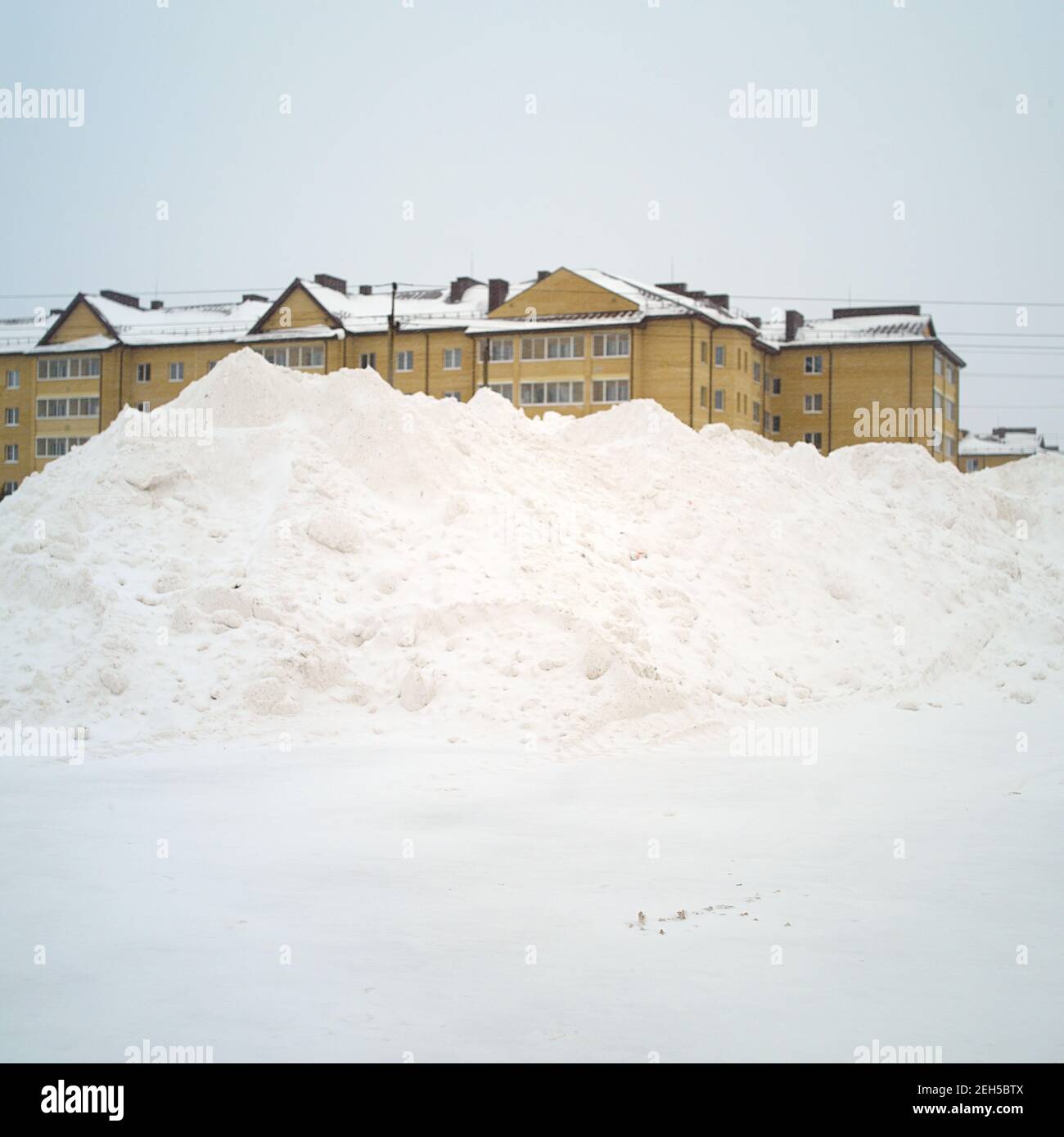 A huge snowdrift and modern buildings, winter scene Stock Photo - Alamy