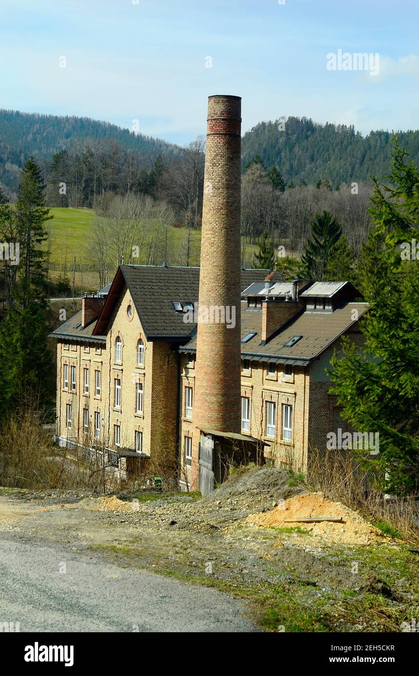 Austria, factory with chimney converted for residential home Stock ...