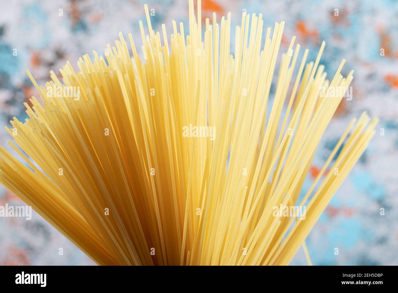 Bunch of spaghetti close-up. Ingredients on the table. Food background ...