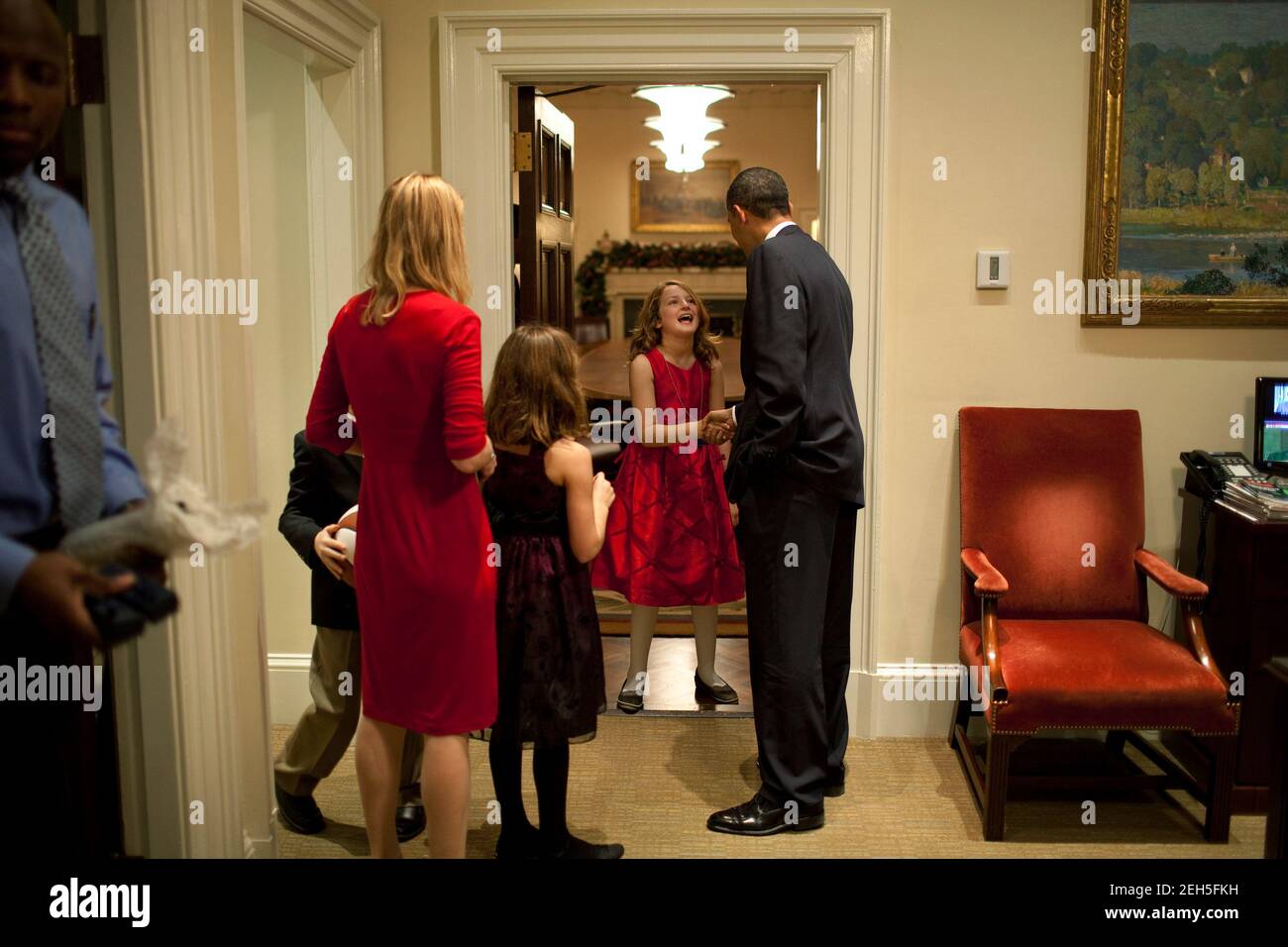 President Barack Obama greets the family of Katie Stanton, a departing ...
