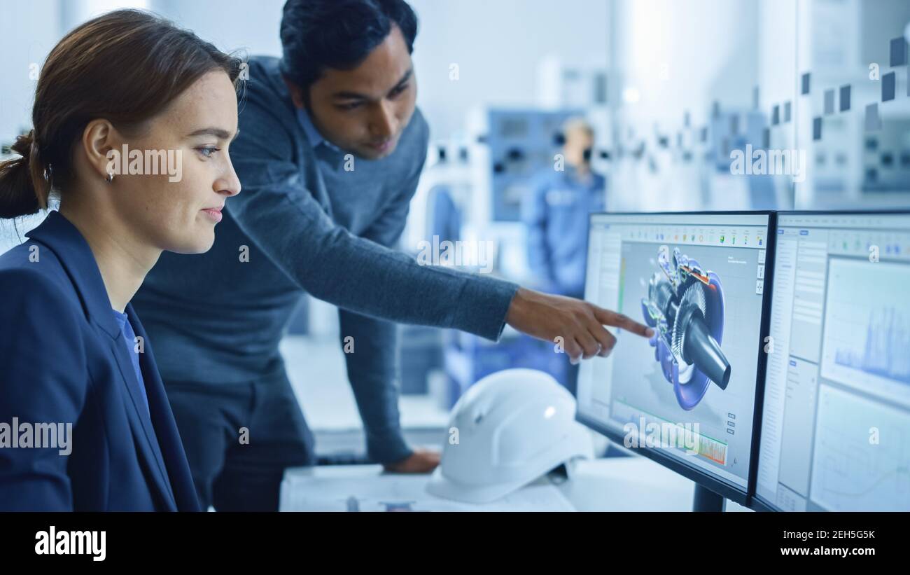 " In Factory Workshop: Professional Workers Use High-Tech Industrial ...