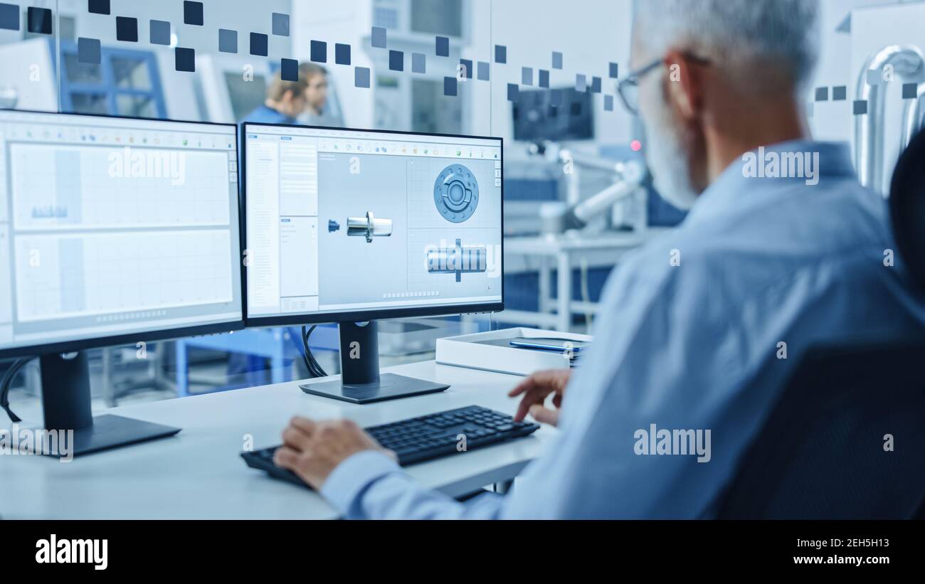 Over the Shoulder: Senior Heavy Industry Engineer Working on Personal ...