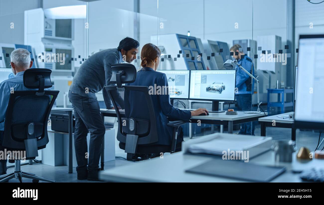 Automotive Design Factory: Project Manager and Chief Mechanical Engineer Talk, Point at Computer ...