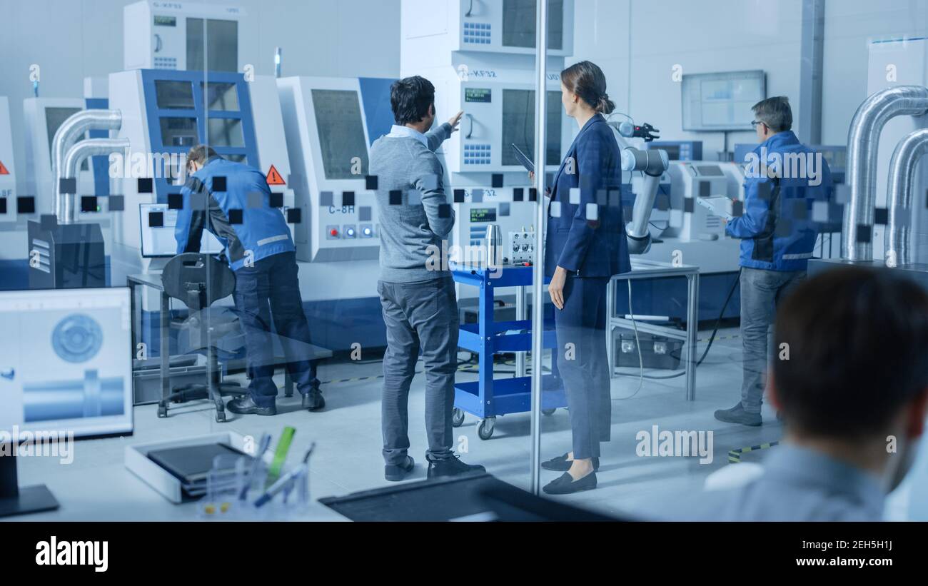 Modern Factory Office: Team of Industrial Engineers Working on ...