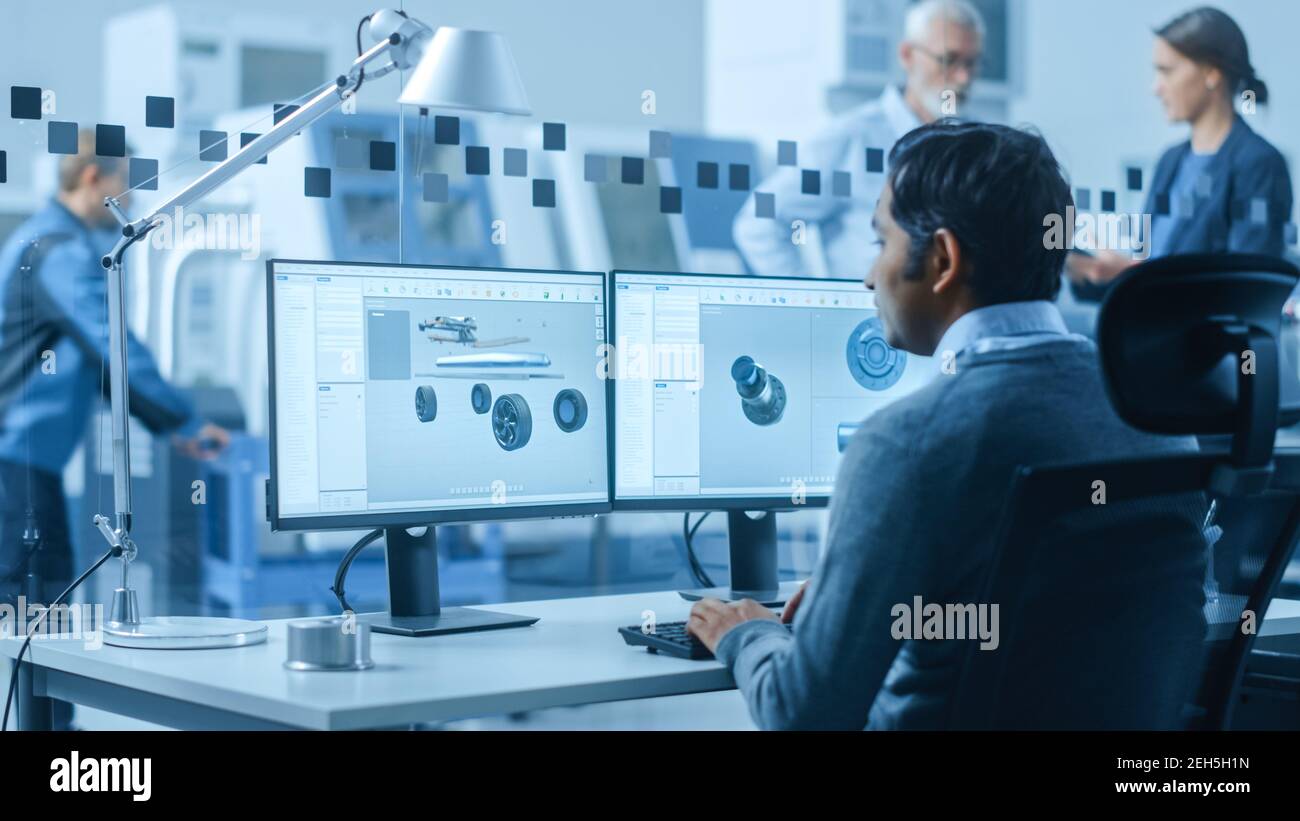 Modern Factory Office: Automotive Engineer Working on PC with Screen ...