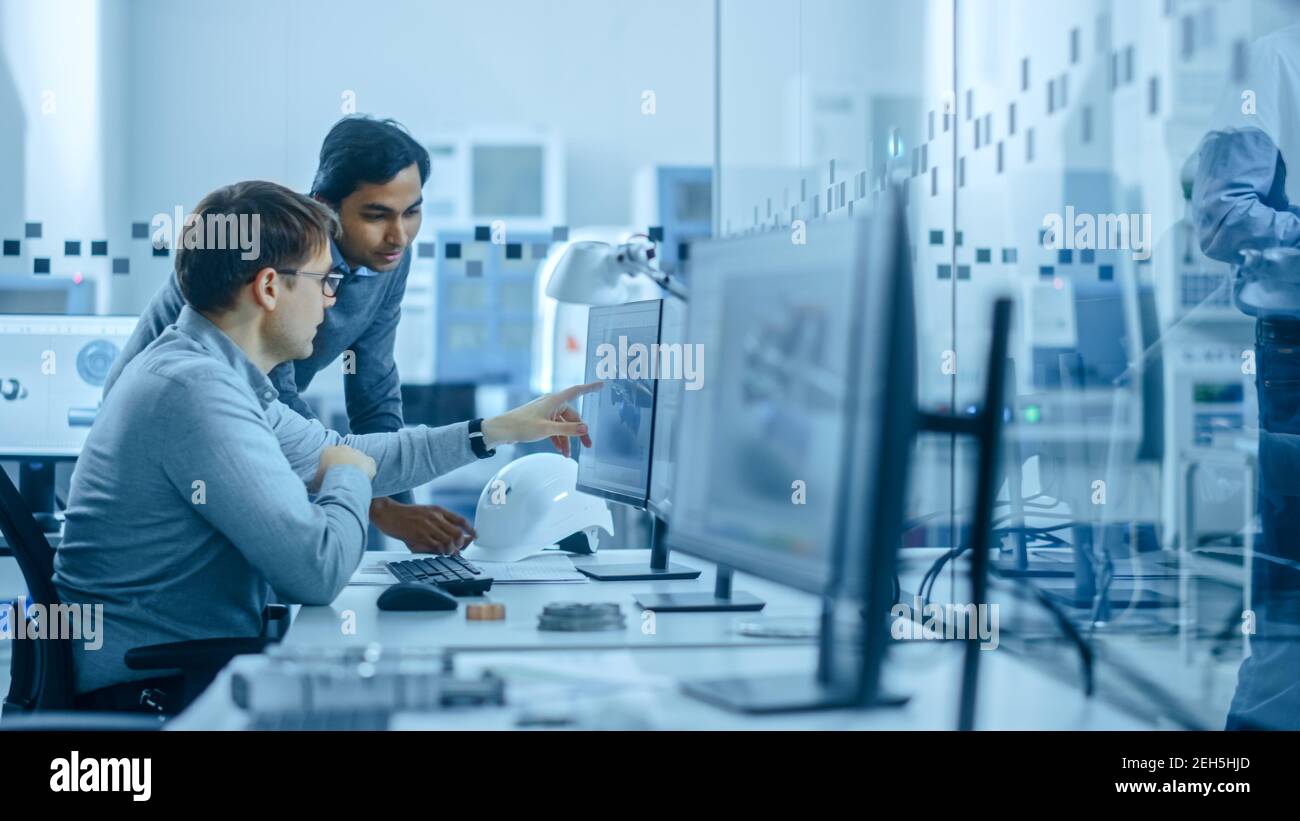 Inside Office: Digital Engineering Professional Working on Personal ...