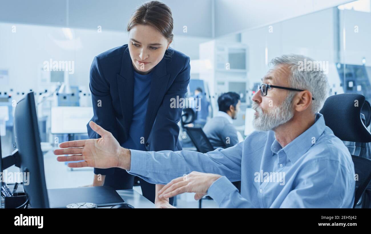 Modern Factory Office Young Confident Female Project Manager Talks to ...