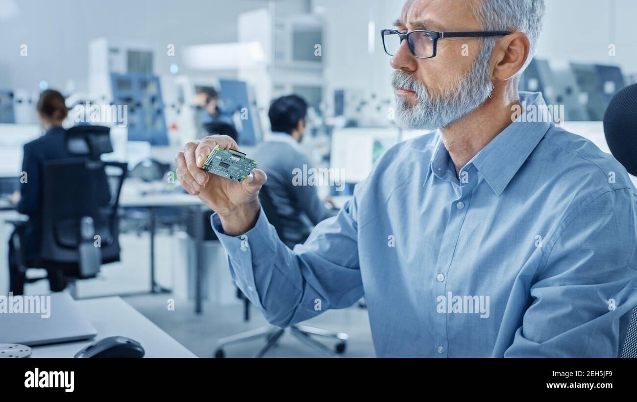 Electronics Design Factory Office: Electrical Engineer Working on ...