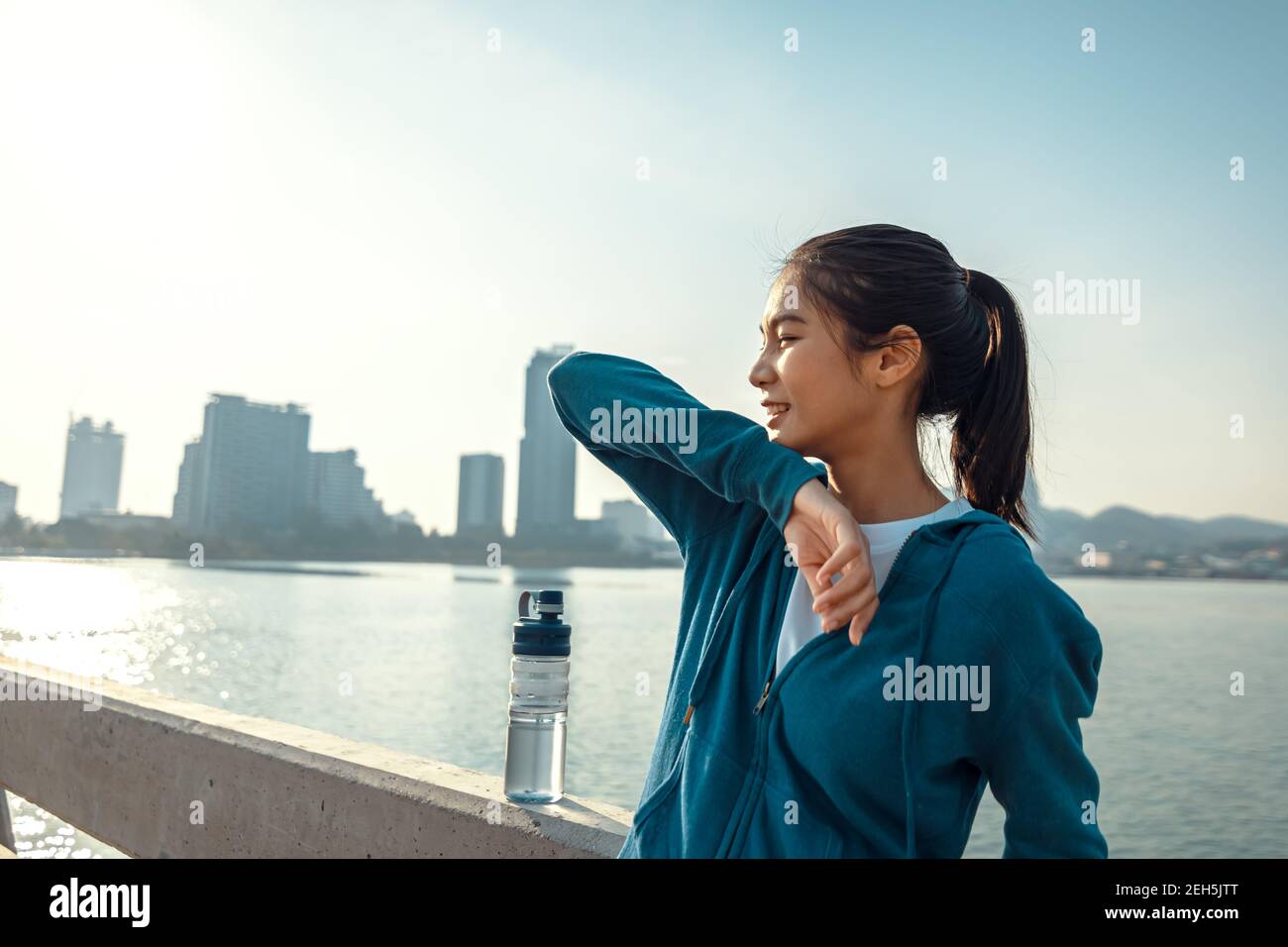 woman runner takes a break after jogging in the morining Stock Photo ...