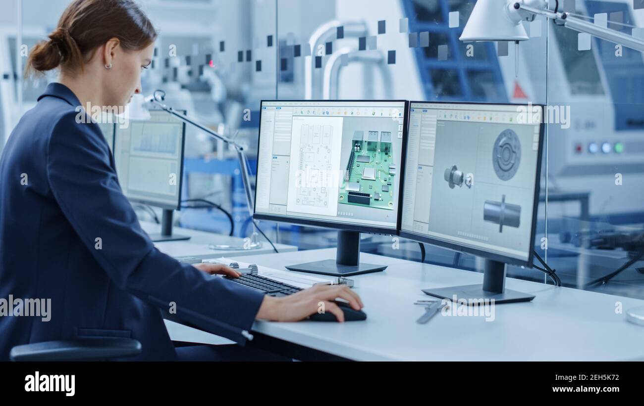 Female Engineer Working on a Personal Computer, Two Monitor Screens ...