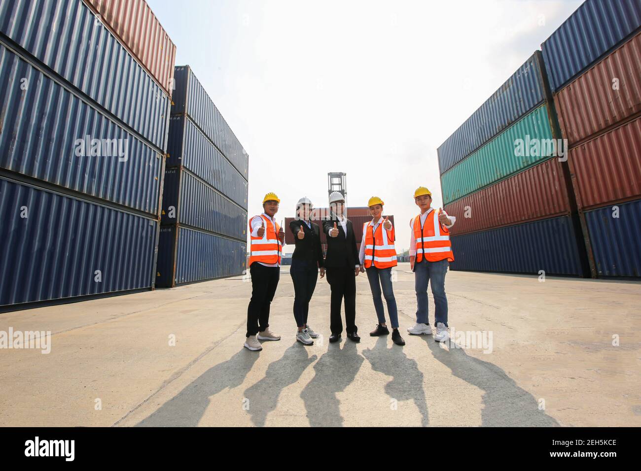 Engineer or supervisor checking and control loading Containers box from ...