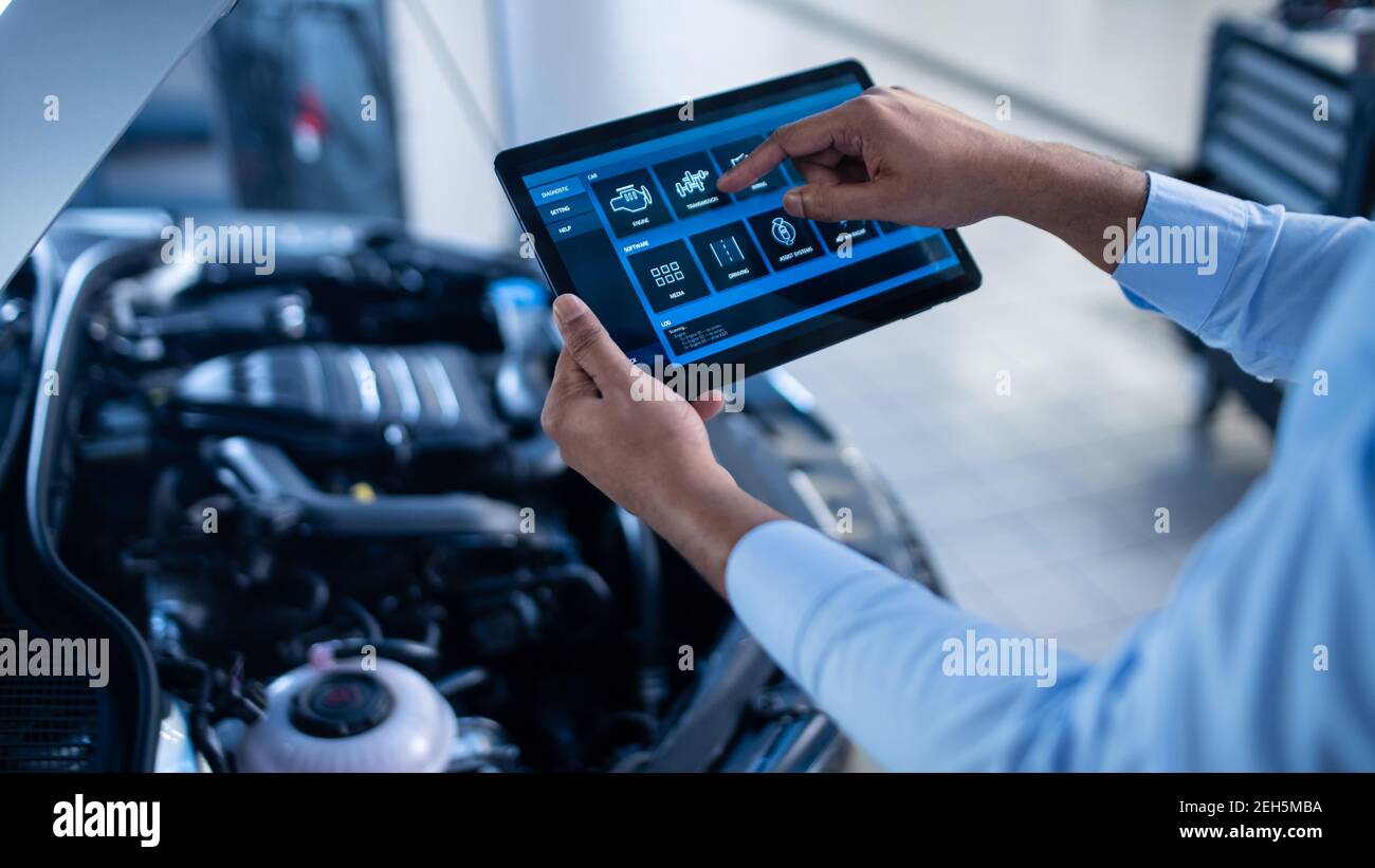 Repairman in car service uses hi-res stock photography and images - Alamy