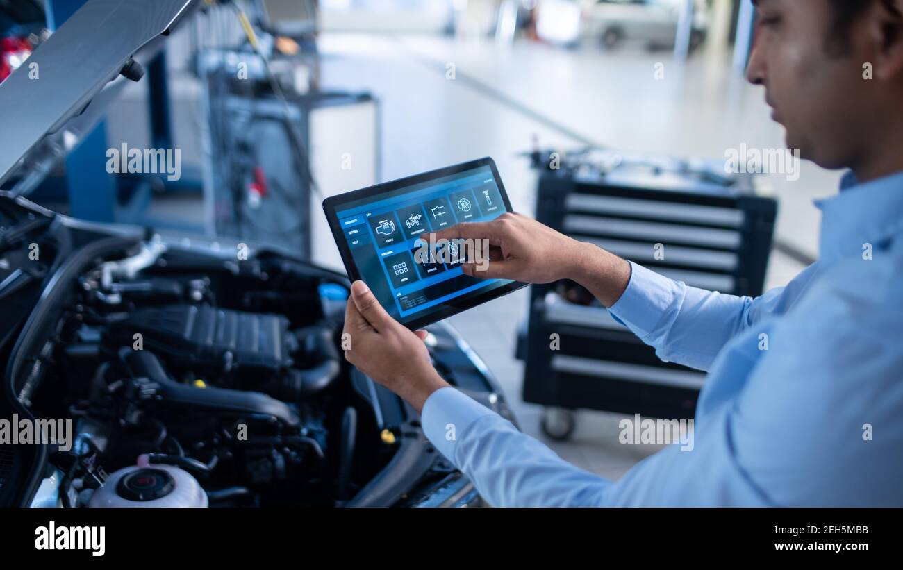 Repairman in car service uses hi-res stock photography and images - Alamy