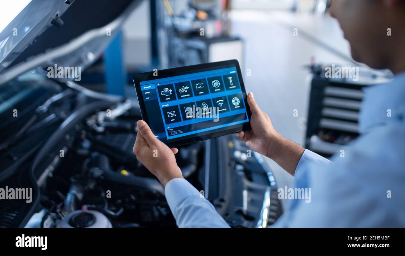 Repairman in car service uses hi-res stock photography and images - Alamy