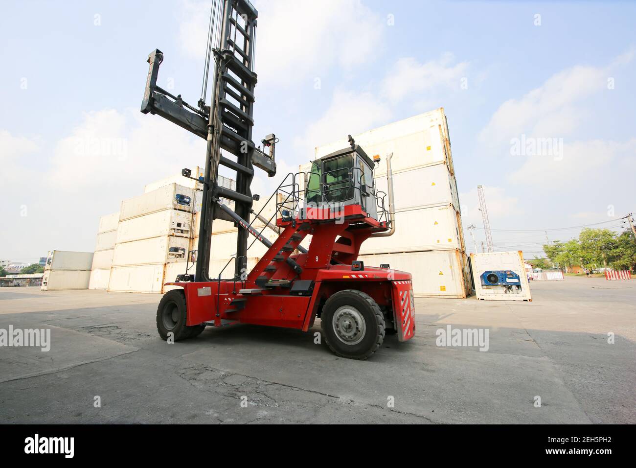 Engineer or supervisor checking and control loading Containers box from ...