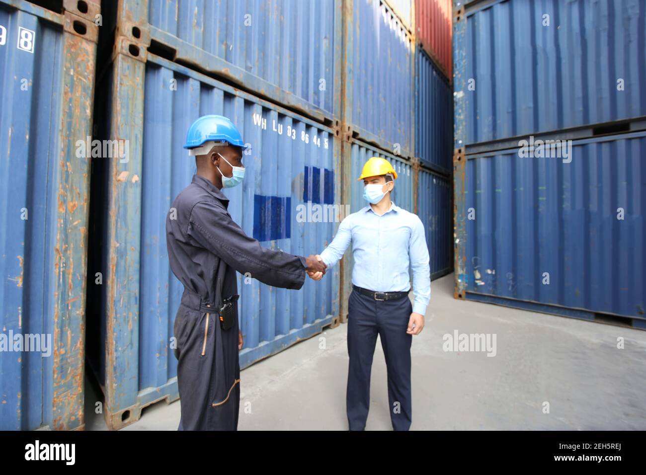 Engineer or supervisor checking and control loading Containers box from ...