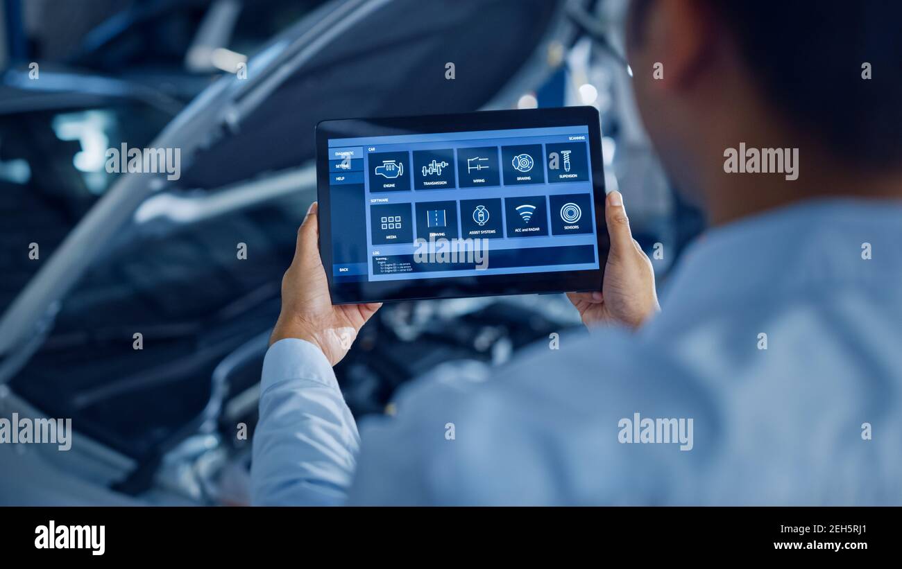 Repairman in car service uses hi-res stock photography and images - Alamy