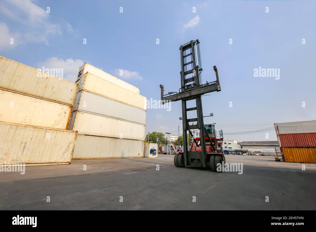 Engineer or supervisor checking and control loading Containers box from ...