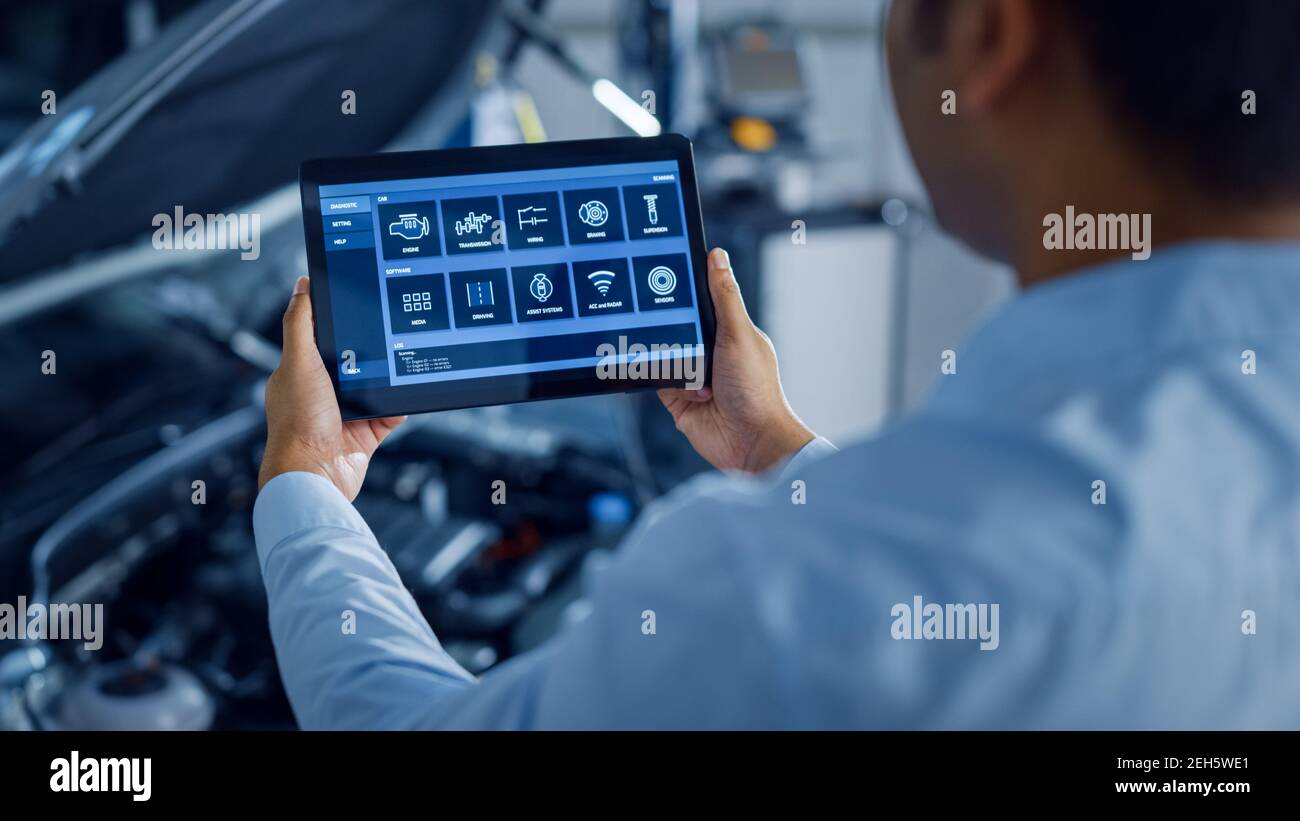 Repairman in car service uses hi-res stock photography and images - Alamy
