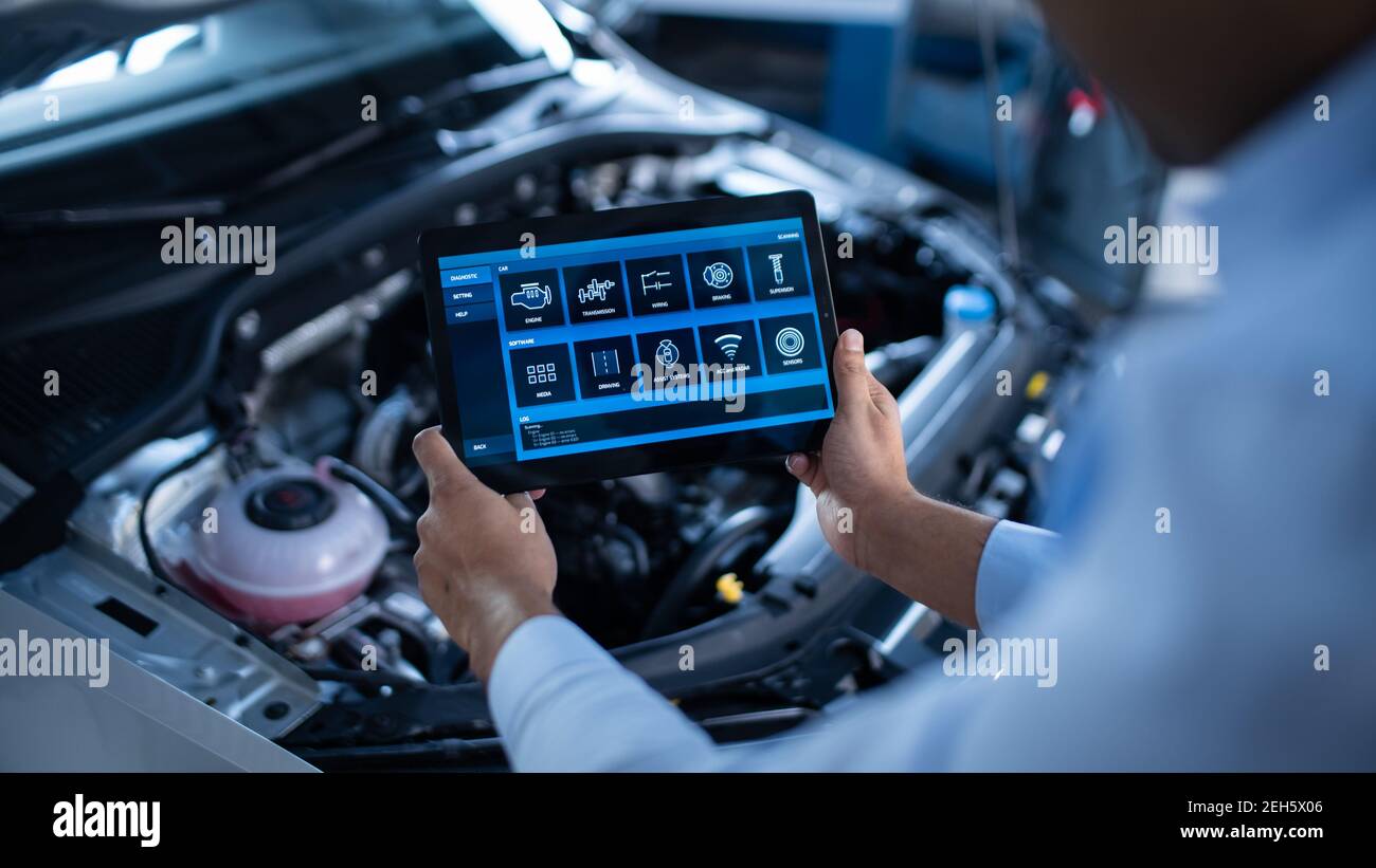 Repairman in car service uses hi-res stock photography and images - Alamy
