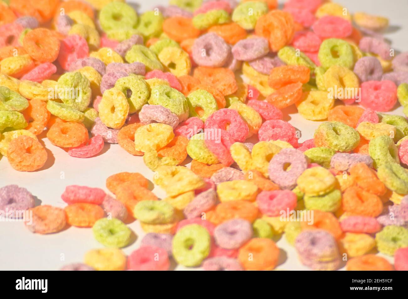 Colorful circular cereals on white background Stock Photo - Alamy