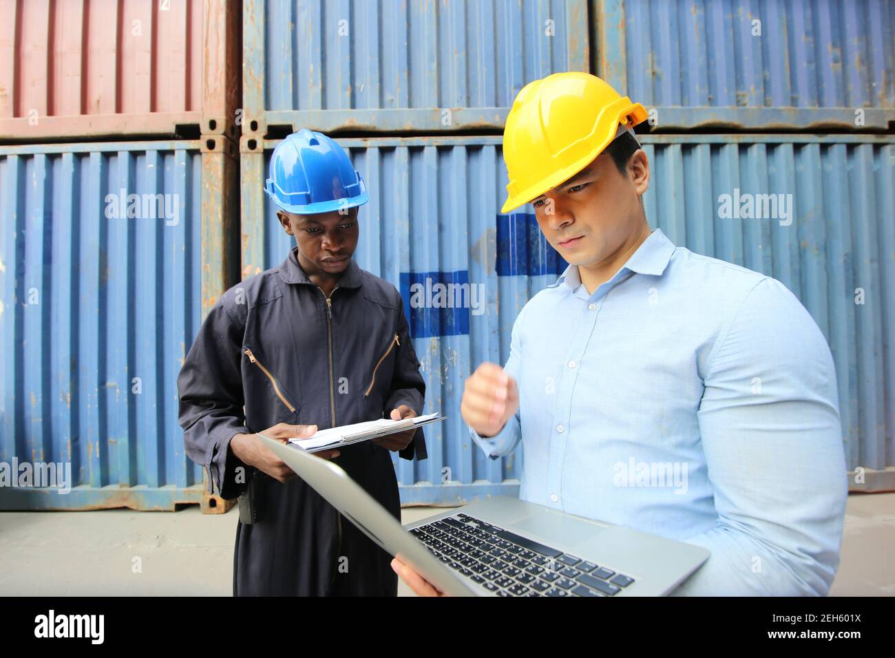 Engineer or supervisor checking and control loading Containers box from ...