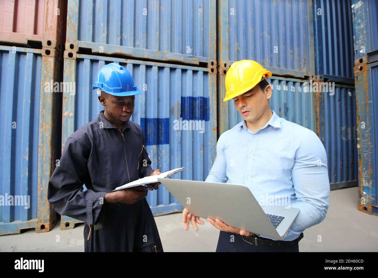 Engineer or supervisor checking and control loading Containers box from ...