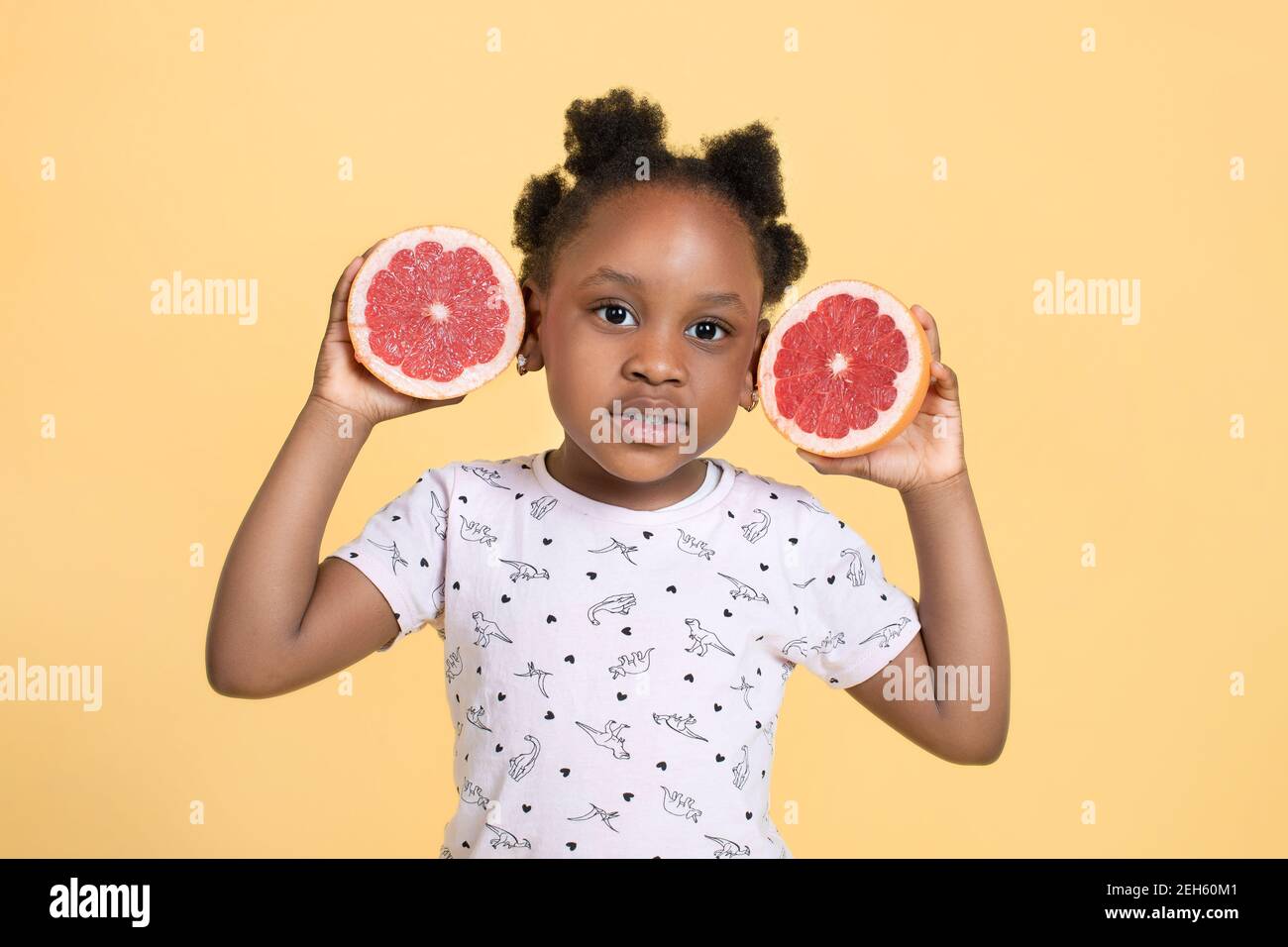 Little pretty afro american child girl having fun, posing with ...