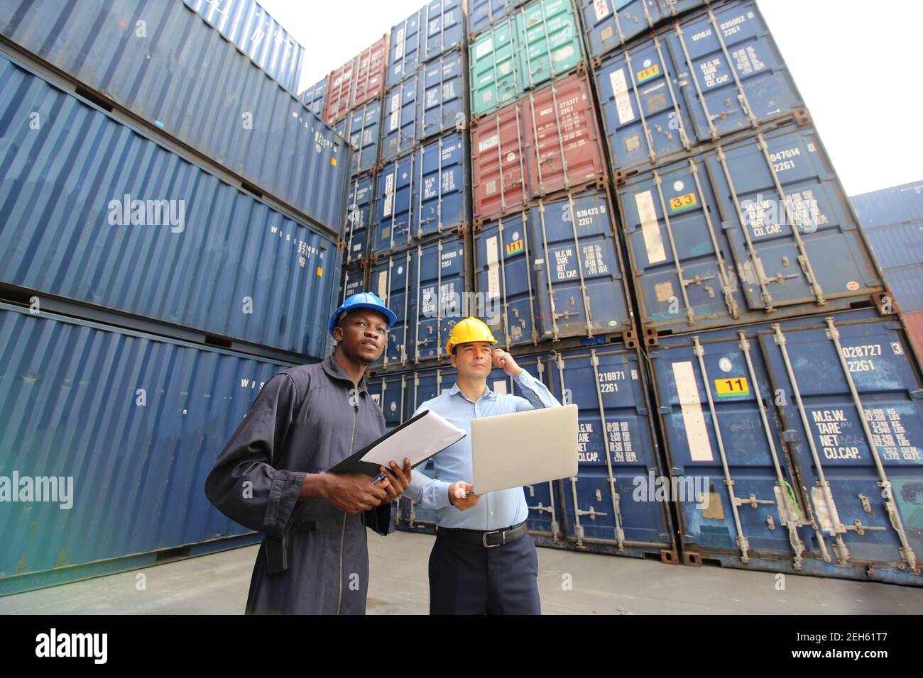Engineer or supervisor checking and control loading Containers box from ...