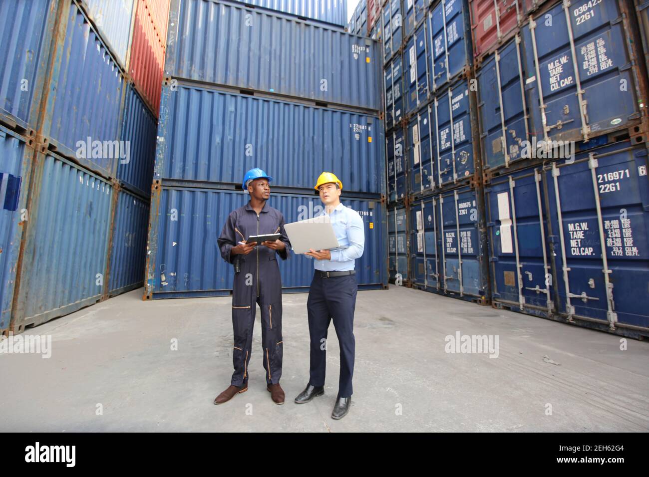 Engineer or supervisor checking and control loading Containers box from ...
