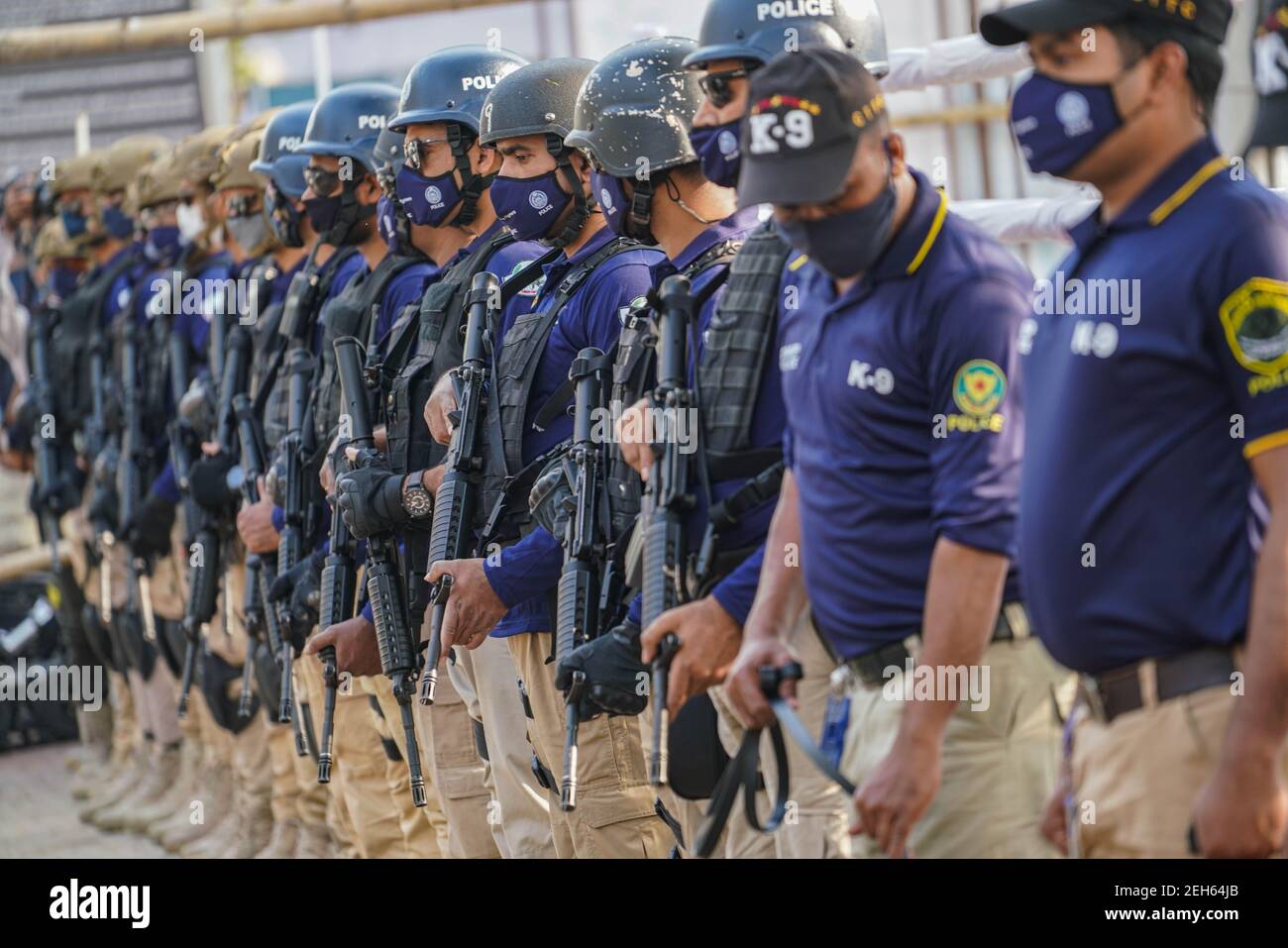SWAT officials are standing in front of Central Shaheed Minar in the ...