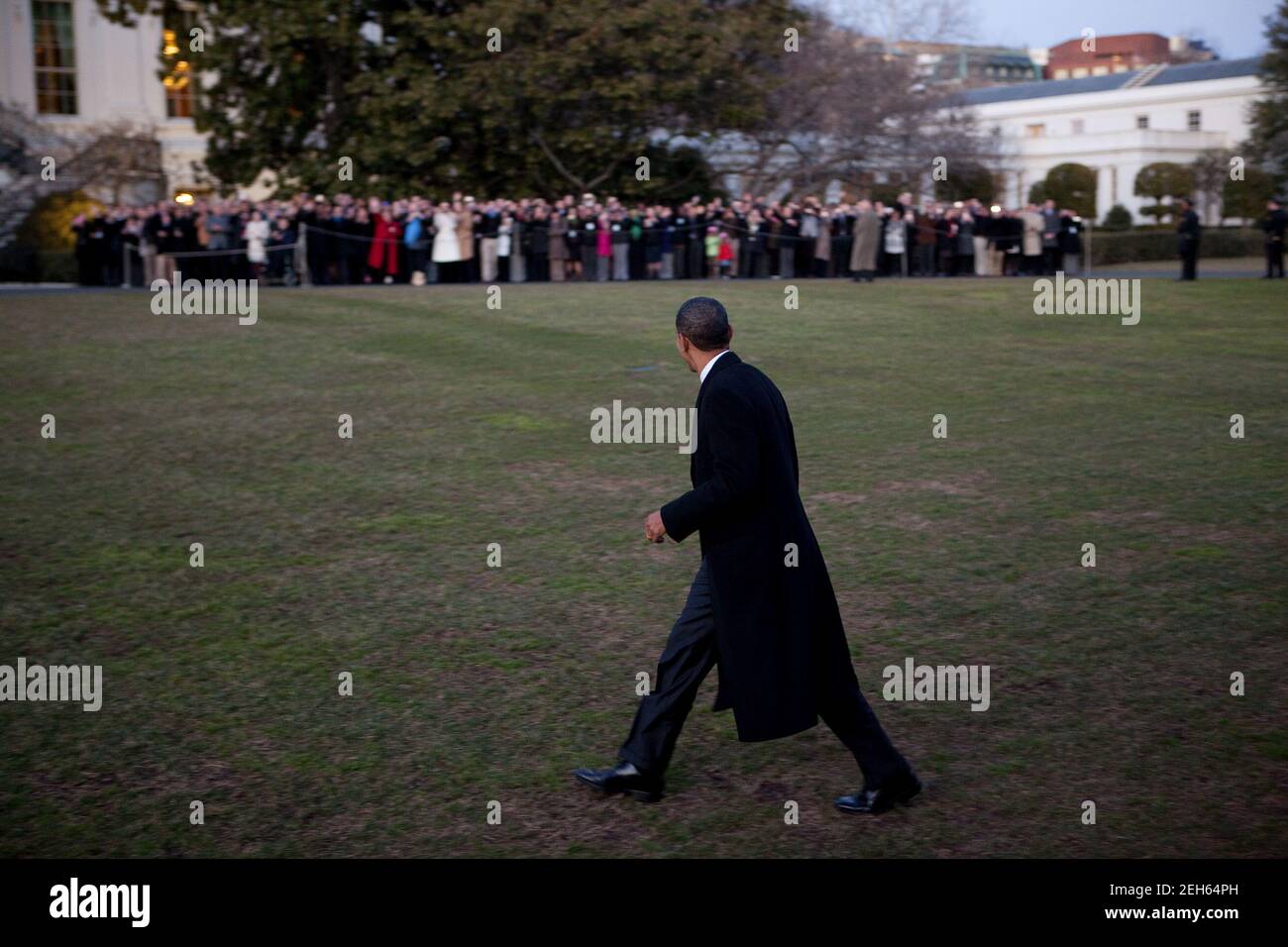 President Barack Obama walks across the South Lawn of the White House ...