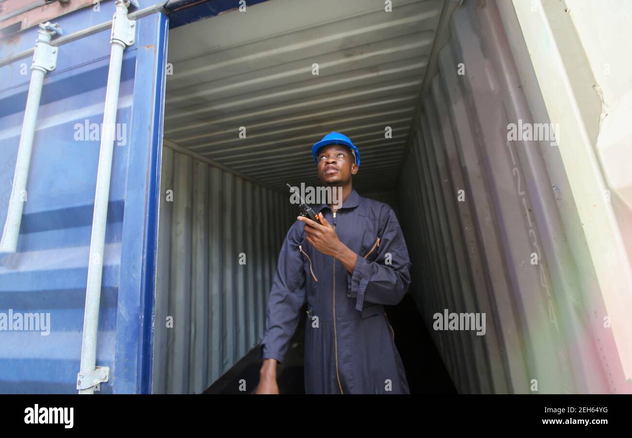 Engineer or supervisor checking and control loading Containers box from ...