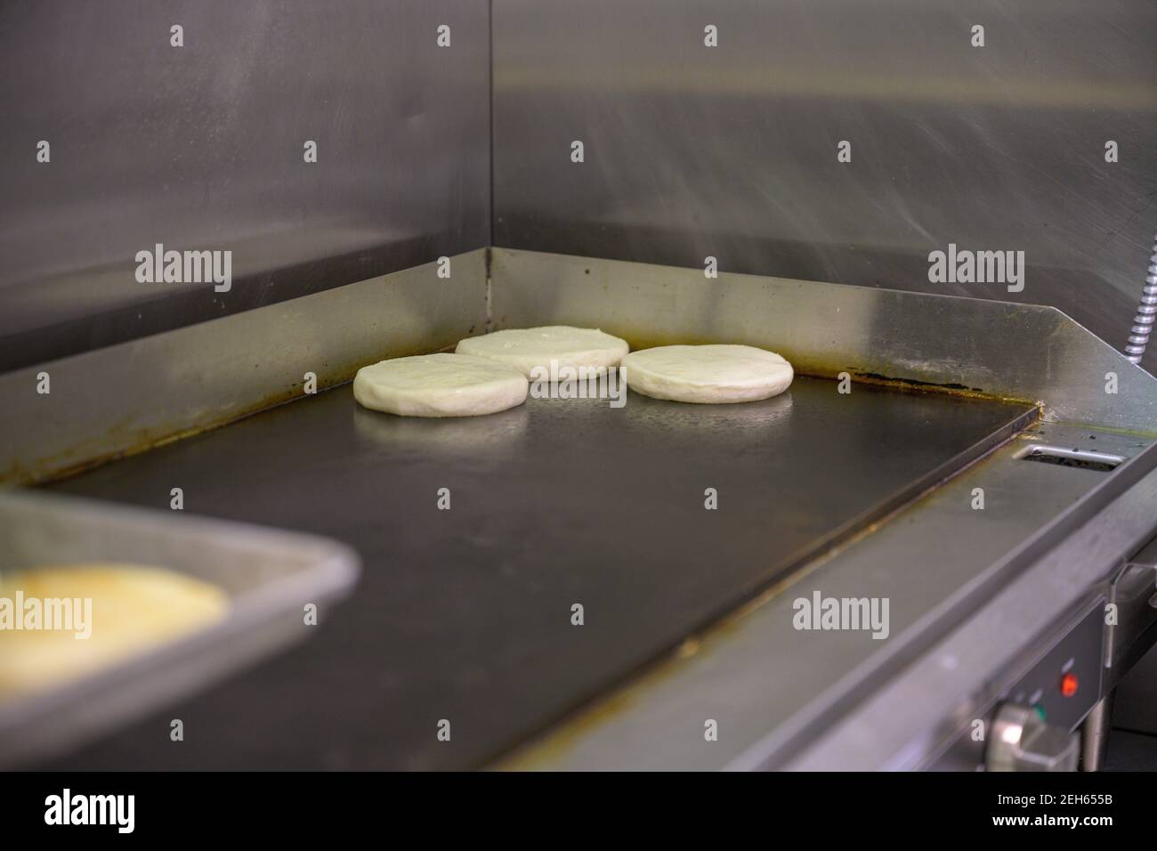 Closeup shot of the process of making sweet Arepas, Venezuelan ...