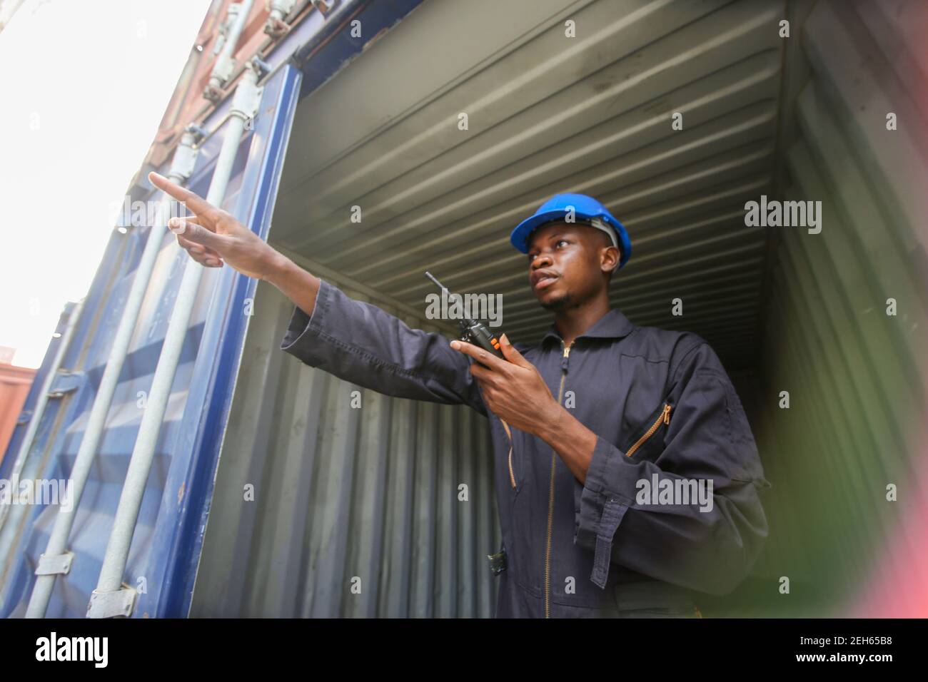 Engineer or supervisor checking and control loading Containers box from ...