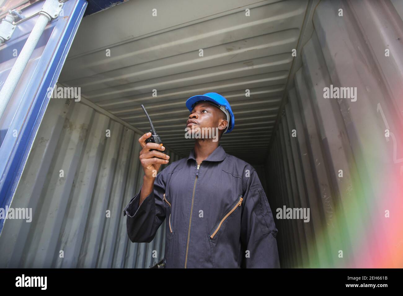 Engineer or supervisor checking and control loading Containers box from ...