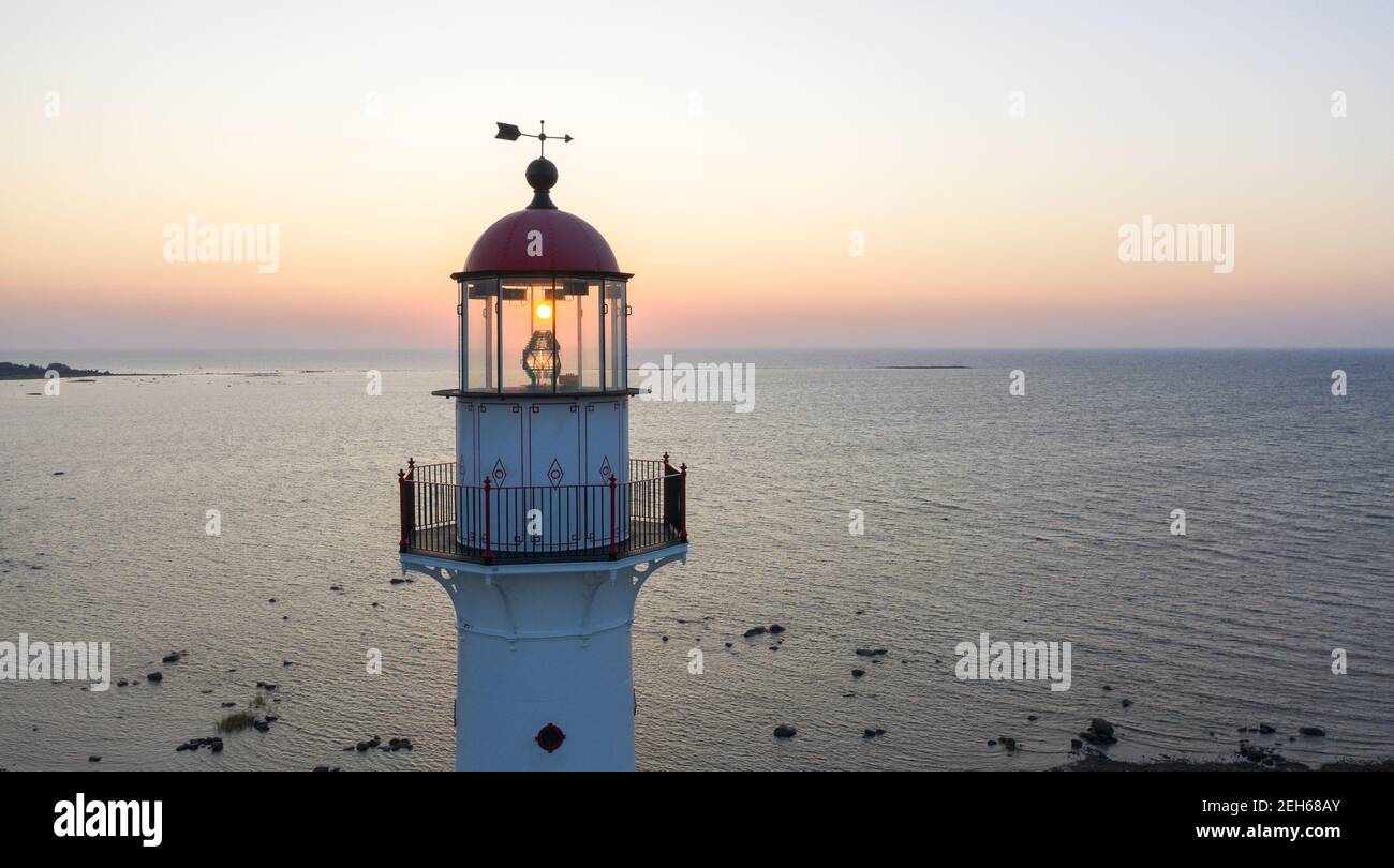 Lighthouse on the Kihnu island in Estonia during a beautiful sunset ...