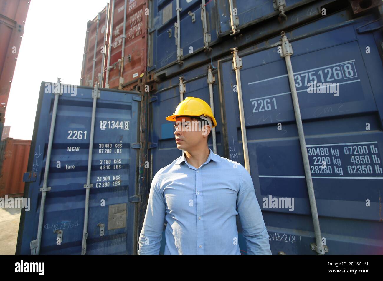 Engineer or supervisor checking and control loading Containers box from ...