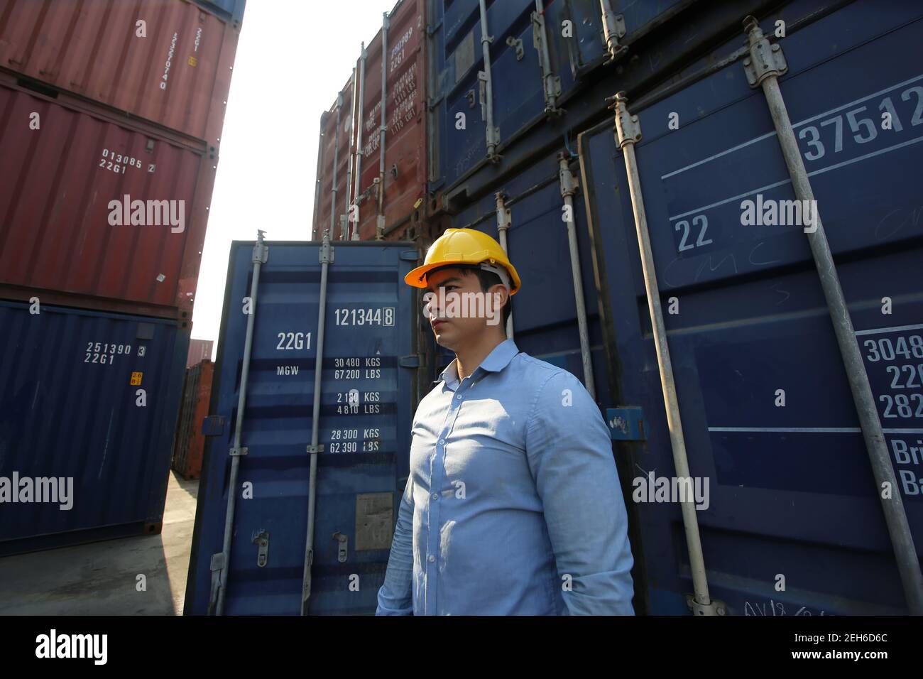 Engineer or supervisor checking and control loading Containers box from ...