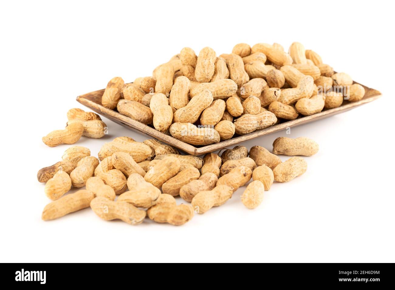 Peanuts in shell on the wooden tray isolated on white background Stock ...